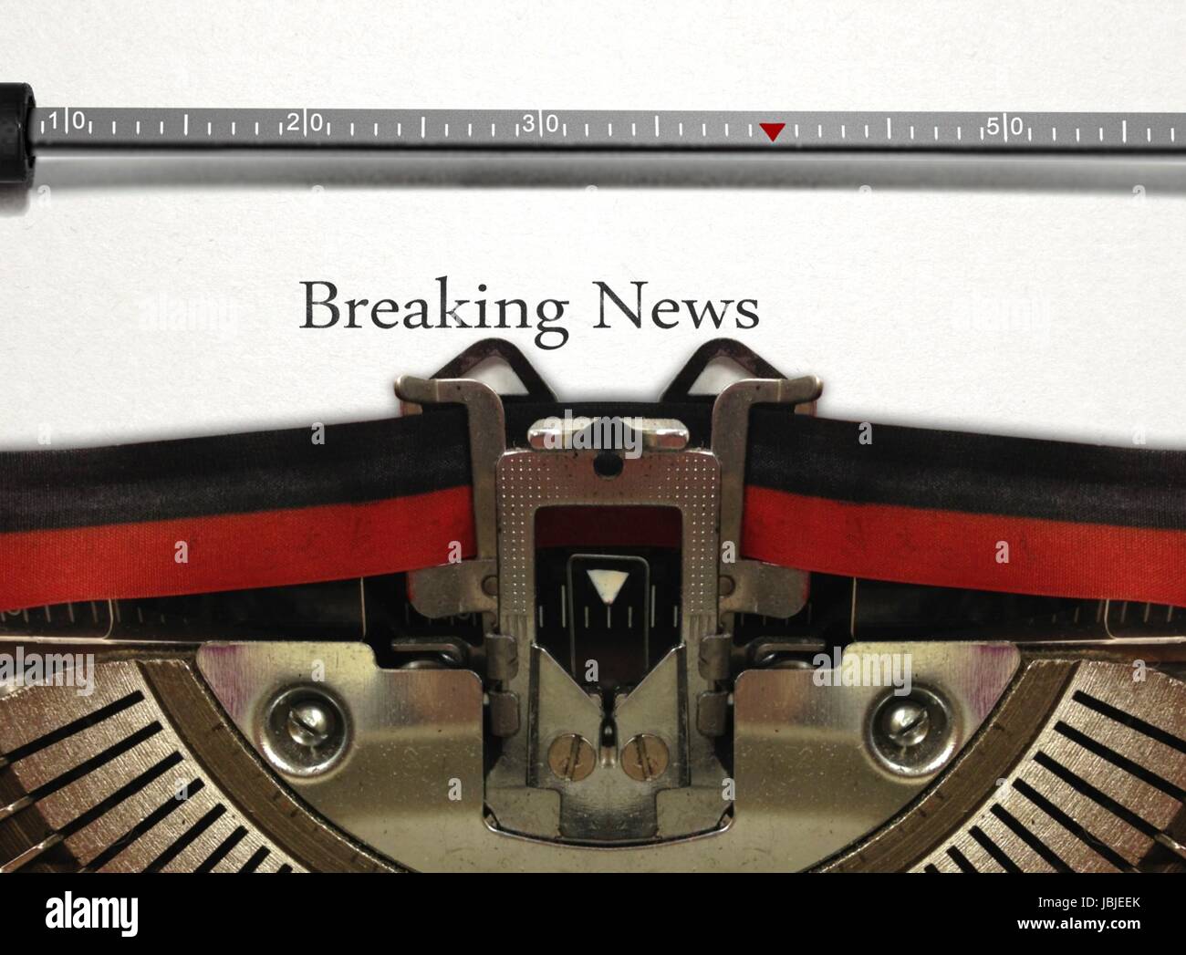 Typewriter with Breaking News Stock Photo - Alamy