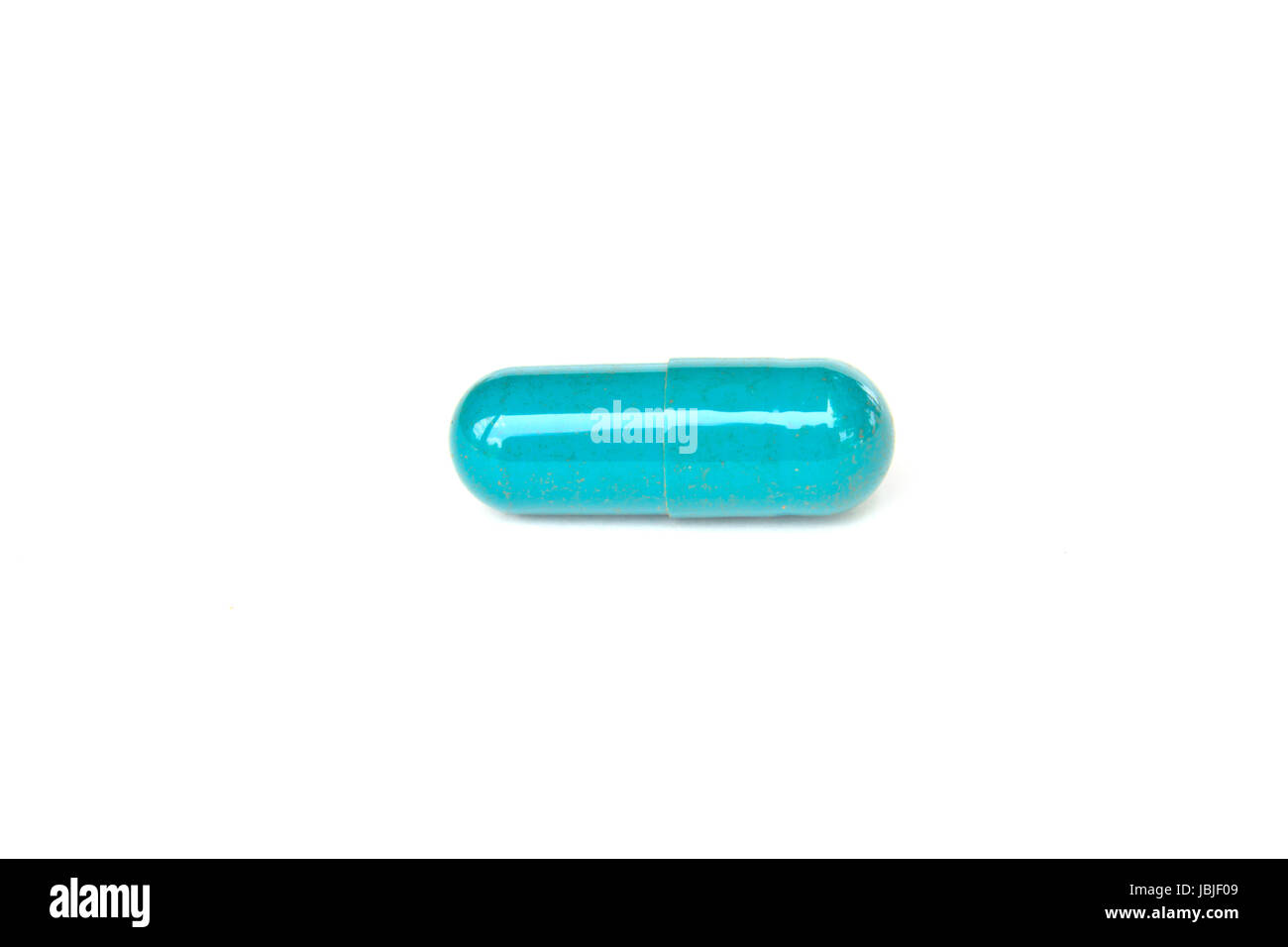 close up of green capsule isolated on white background Stock Photo - Alamy