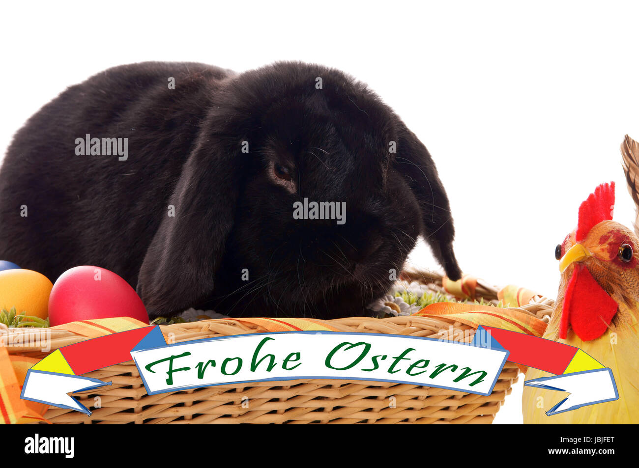 Rooster in the Easter Basket and banner with the german words happy ...