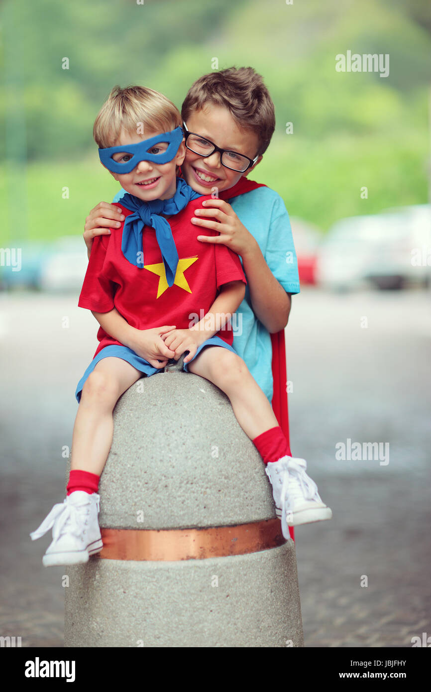 Portrait of two little cheerful superheroes Stock Photo - Alamy