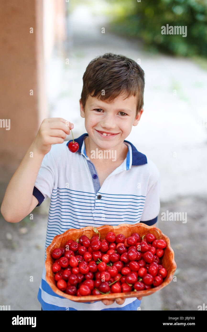 Boy holding food bowl hi-res stock photography and images - Alamy