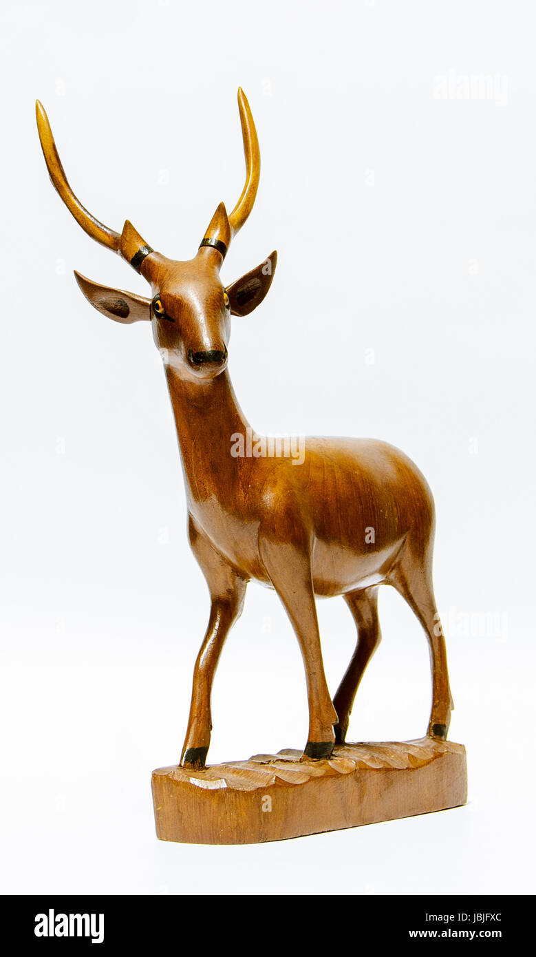 the Carved wooden deer with white background Stock Photo - Alamy
