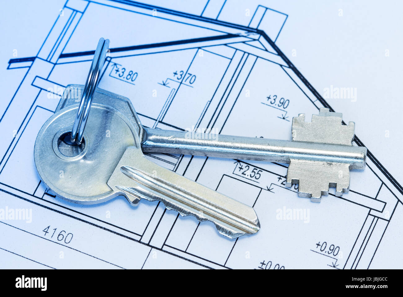 Closeup of keys on blueprint of new home Stock Photo - Alamy