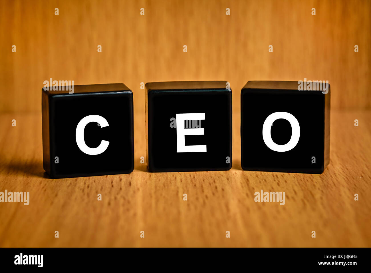 CEO or chief executive officer text on black block Stock Photo - Alamy