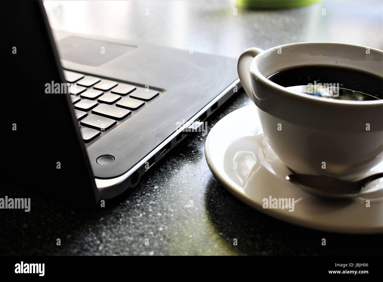 An image of a coffee with laptop in the sun Stock Photo - Alamy