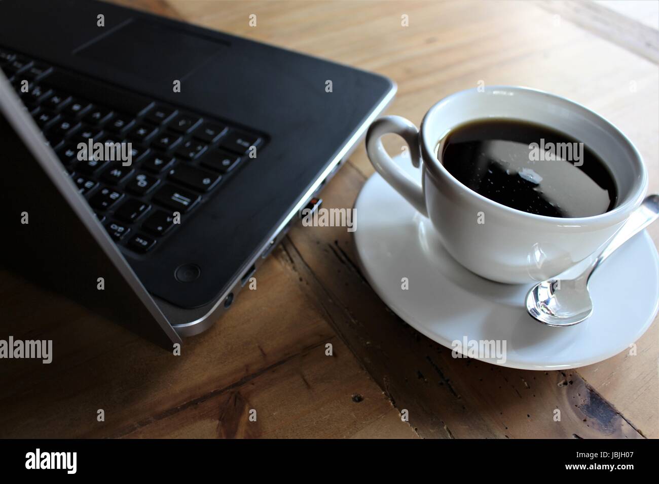 An image of a coffee with laptop in the sun Stock Photo - Alamy