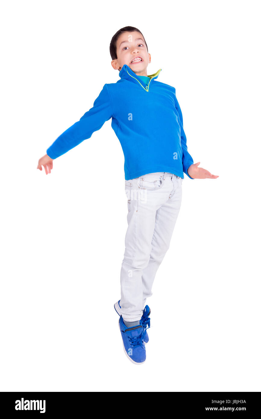 Young boy jumping isolated in white Stock Photo - Alamy