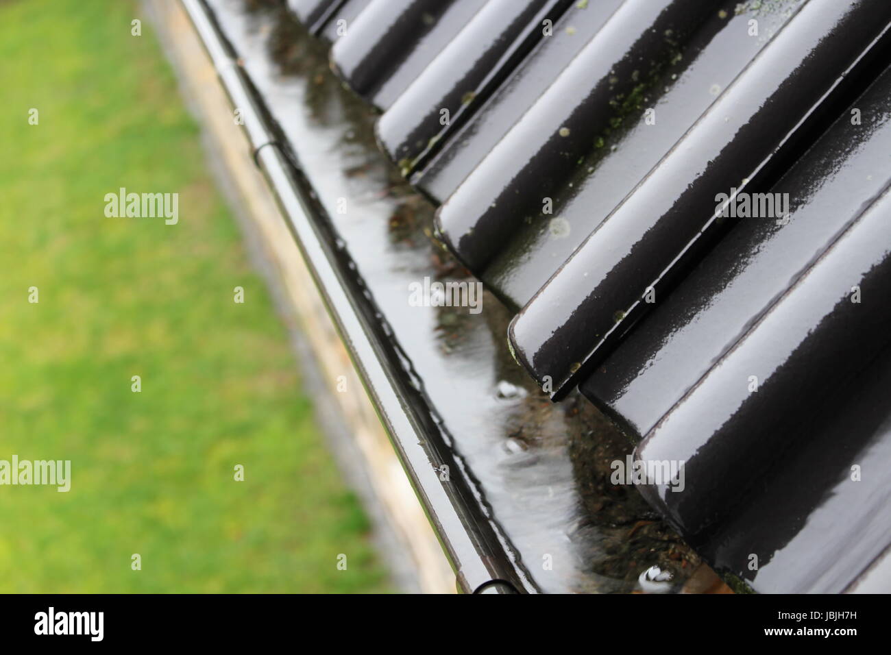 An image of a drain with raindrops Stock Photo - Alamy