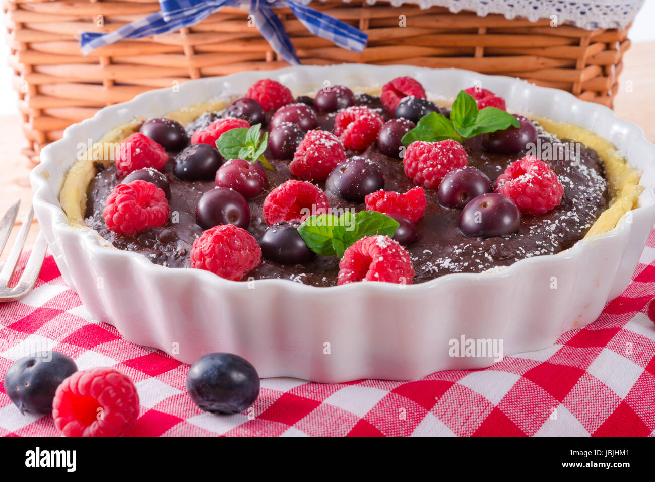 chocolate tartelette with forest fruits Stock Photo - Alamy