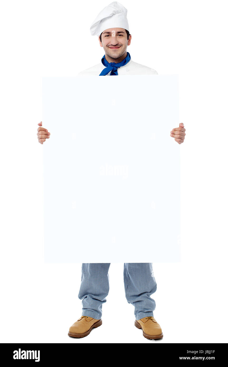 Handsome male chef behind blank ad board Stock Photo - Alamy