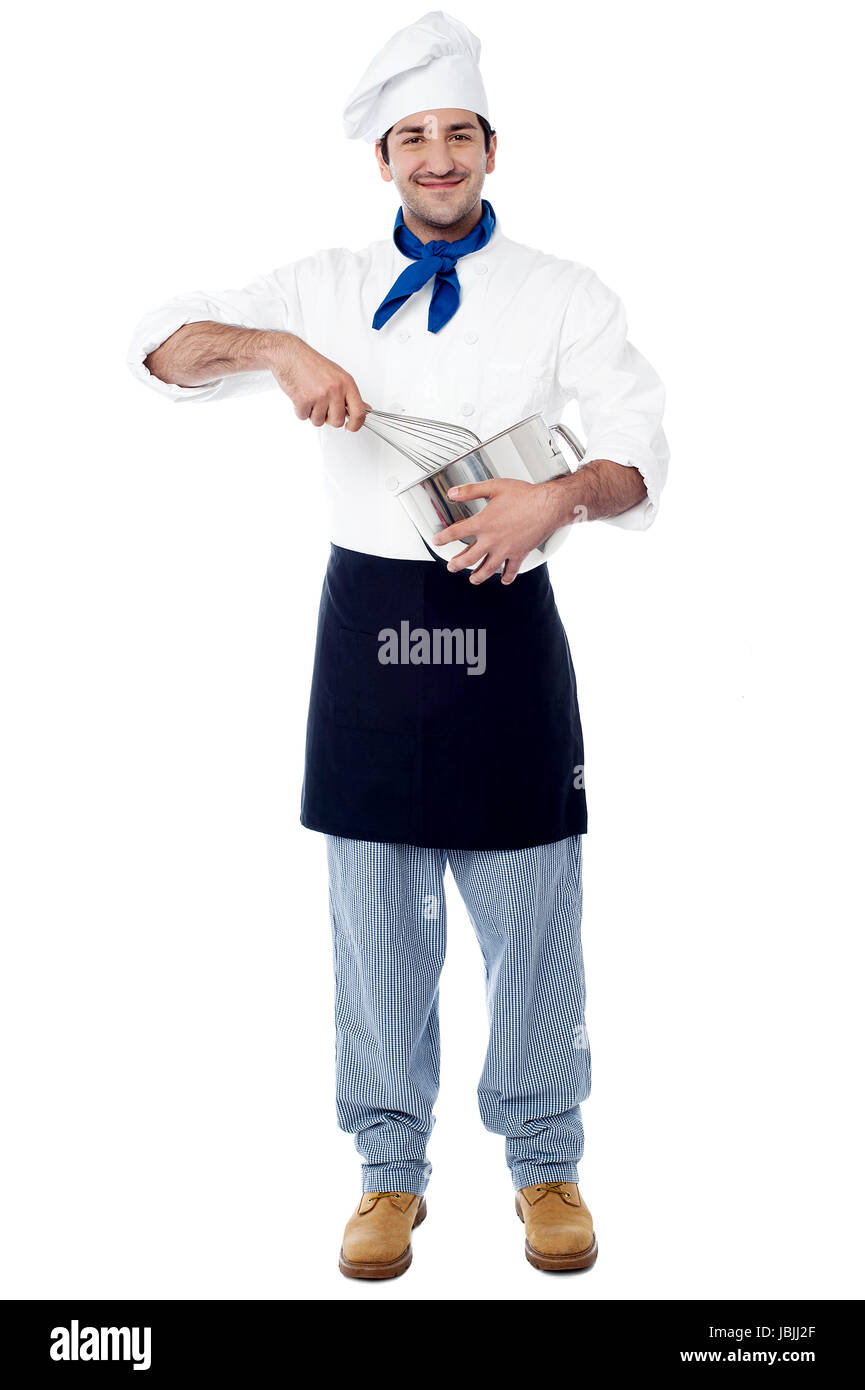 Smiling male chef mixing ingredients in a bowl Stock Photo - Alamy
