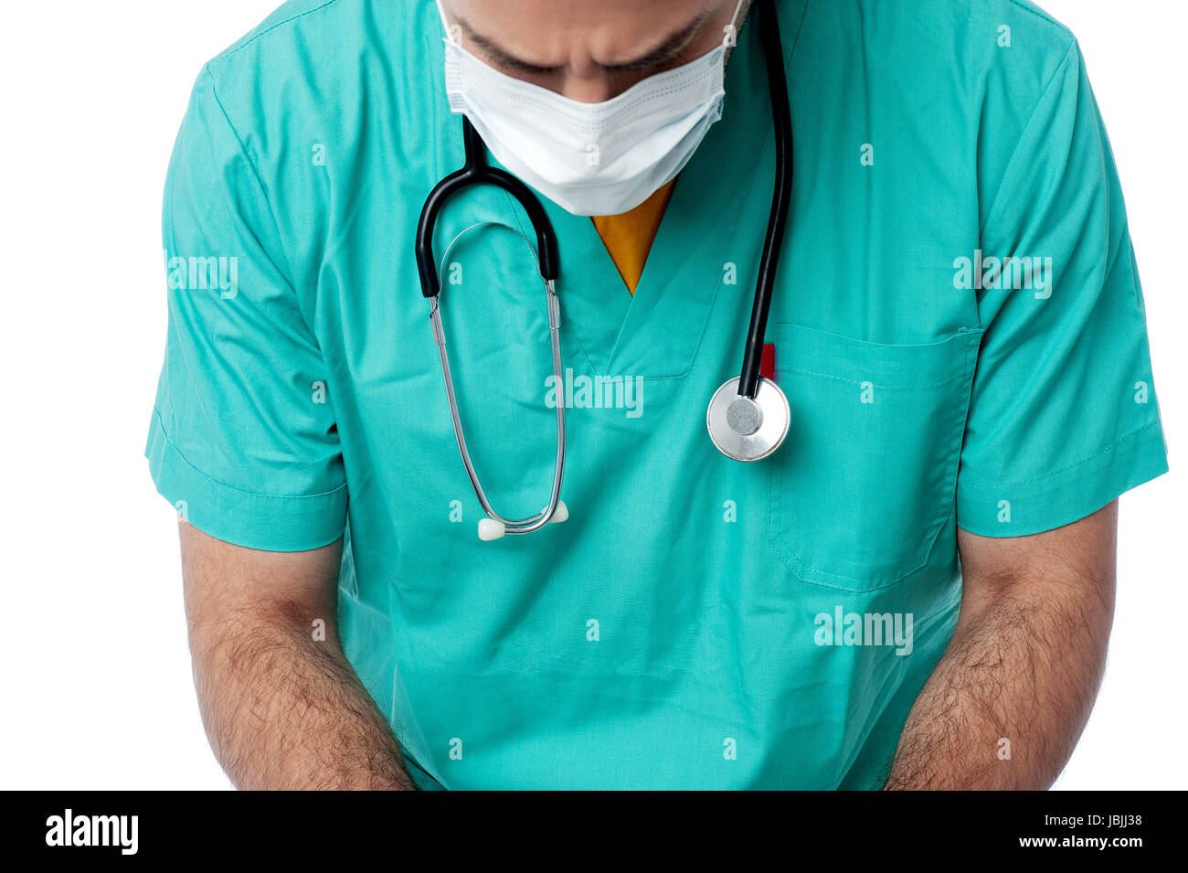 Doctor's face covered with a surgical mask Stock Photo - Alamy