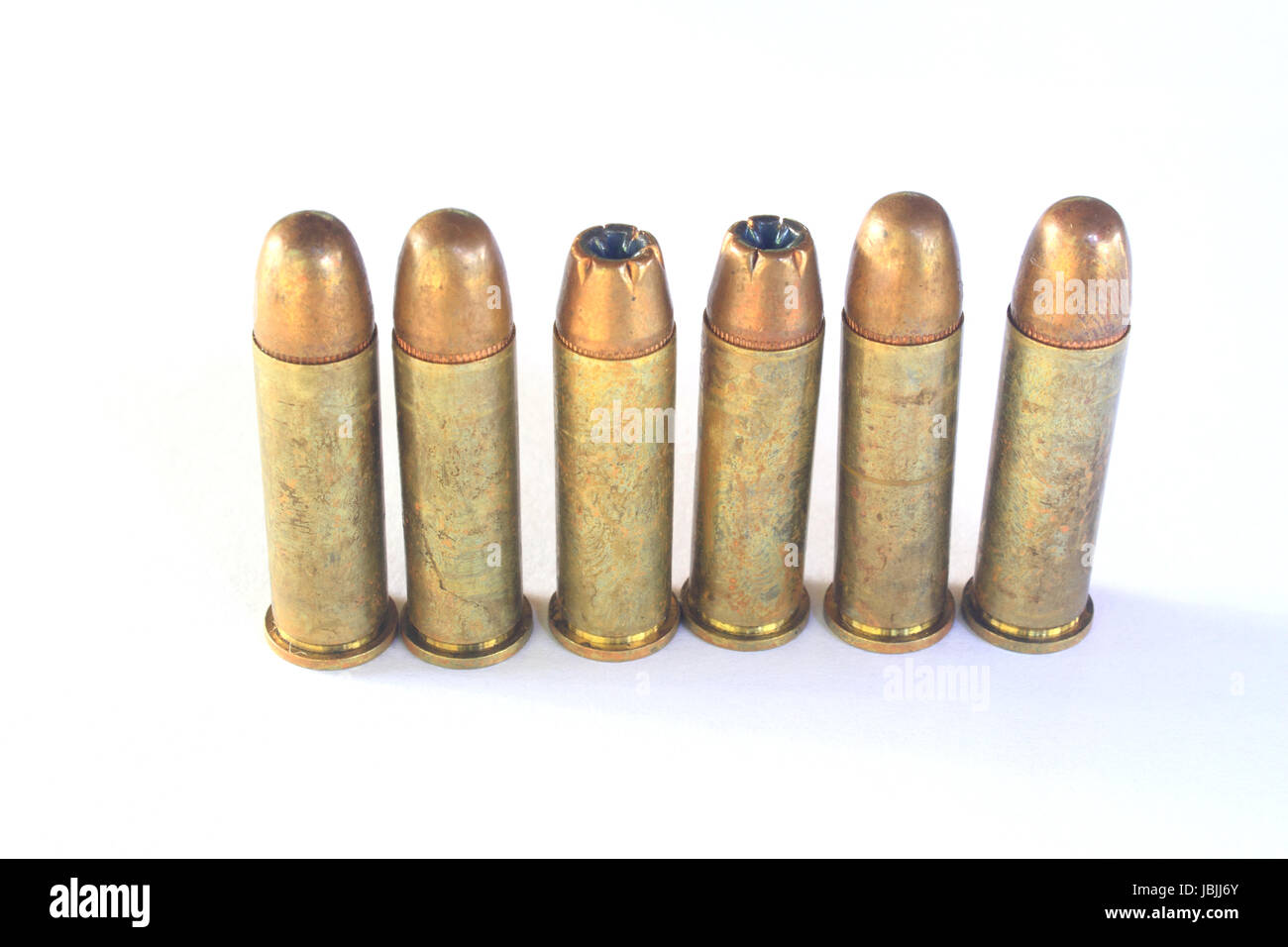 bullets (ammunition) for gun isolated on a white background Stock Photo ...