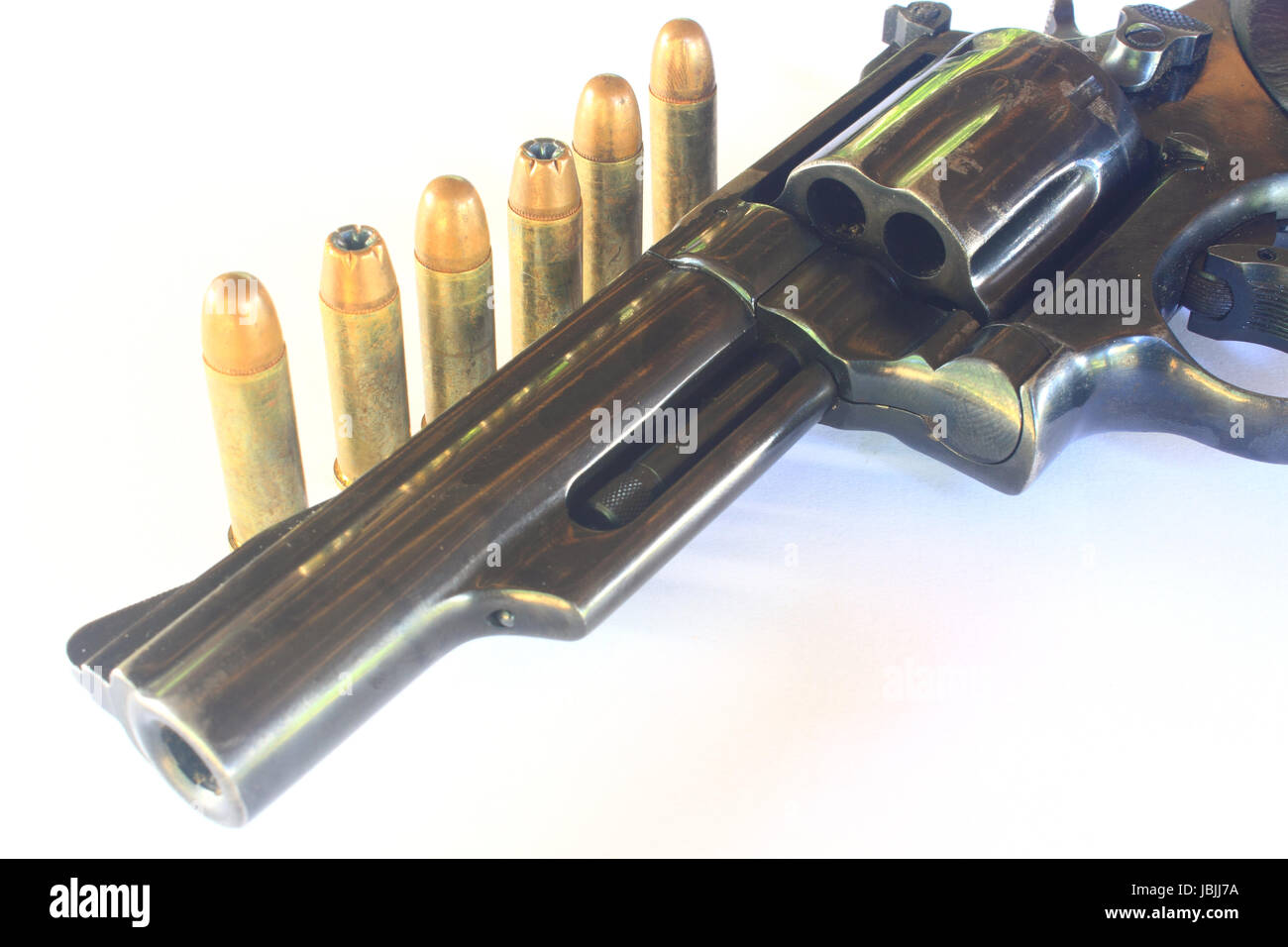 close up Gun with ammunition on white background Stock Photo - Alamy