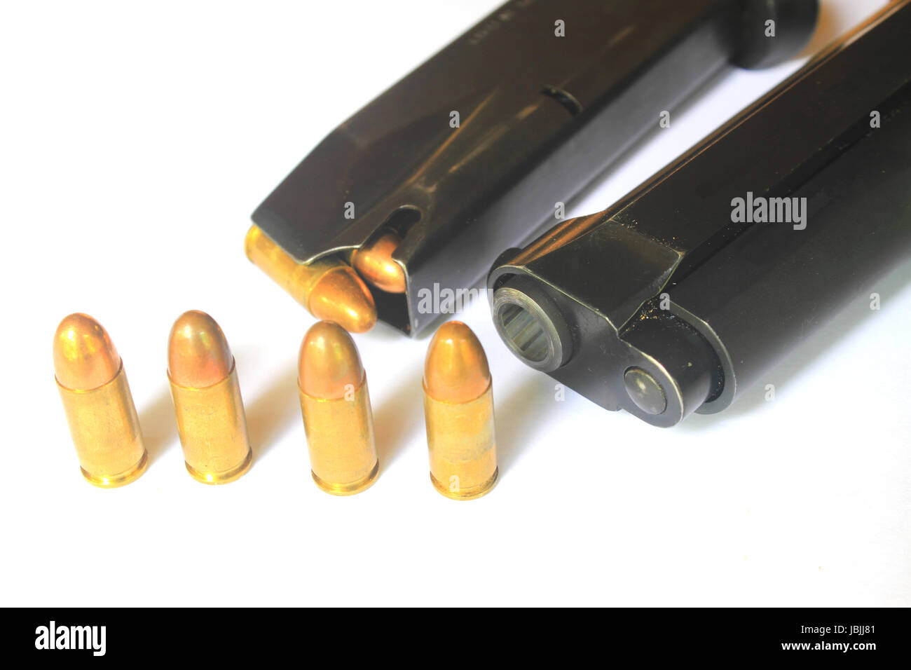 close up Gun with ammunition on white background Stock Photo - Alamy