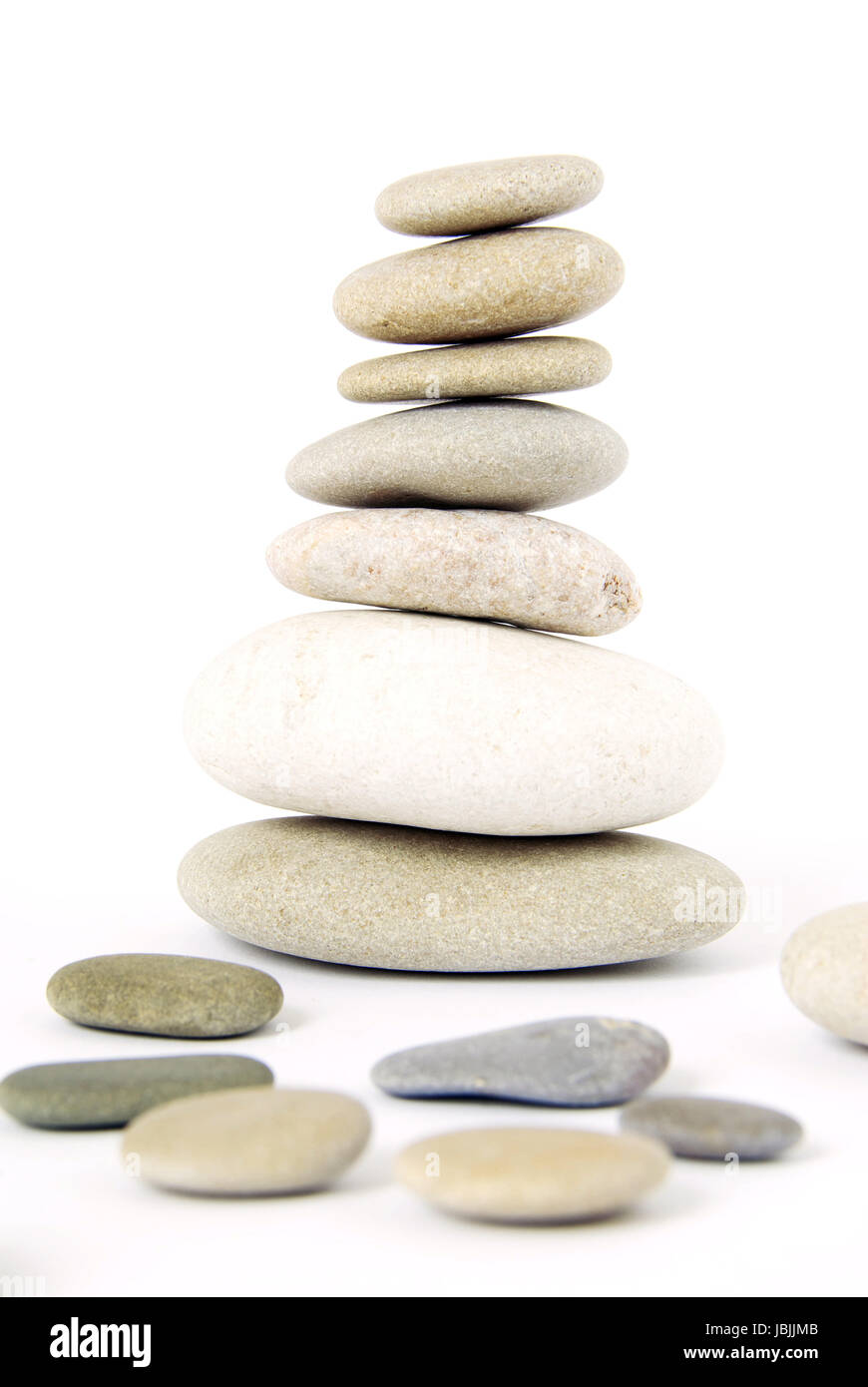 Stack of balanced stones on a white background Stock Photo - Alamy