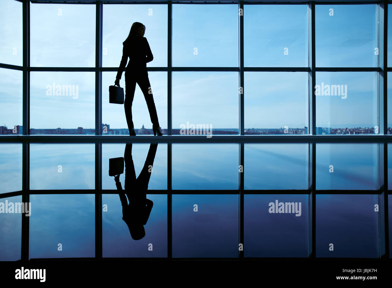 Outline of office worker with briefcase standing by the window Stock ...