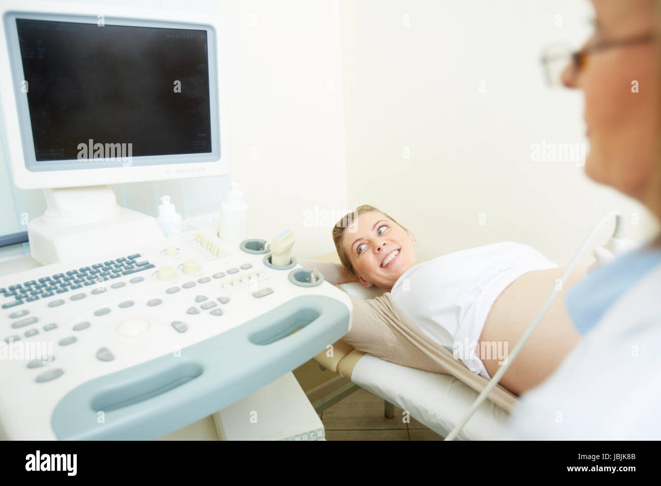 Happy young woman undergoing regular examination at hospital Stock ...