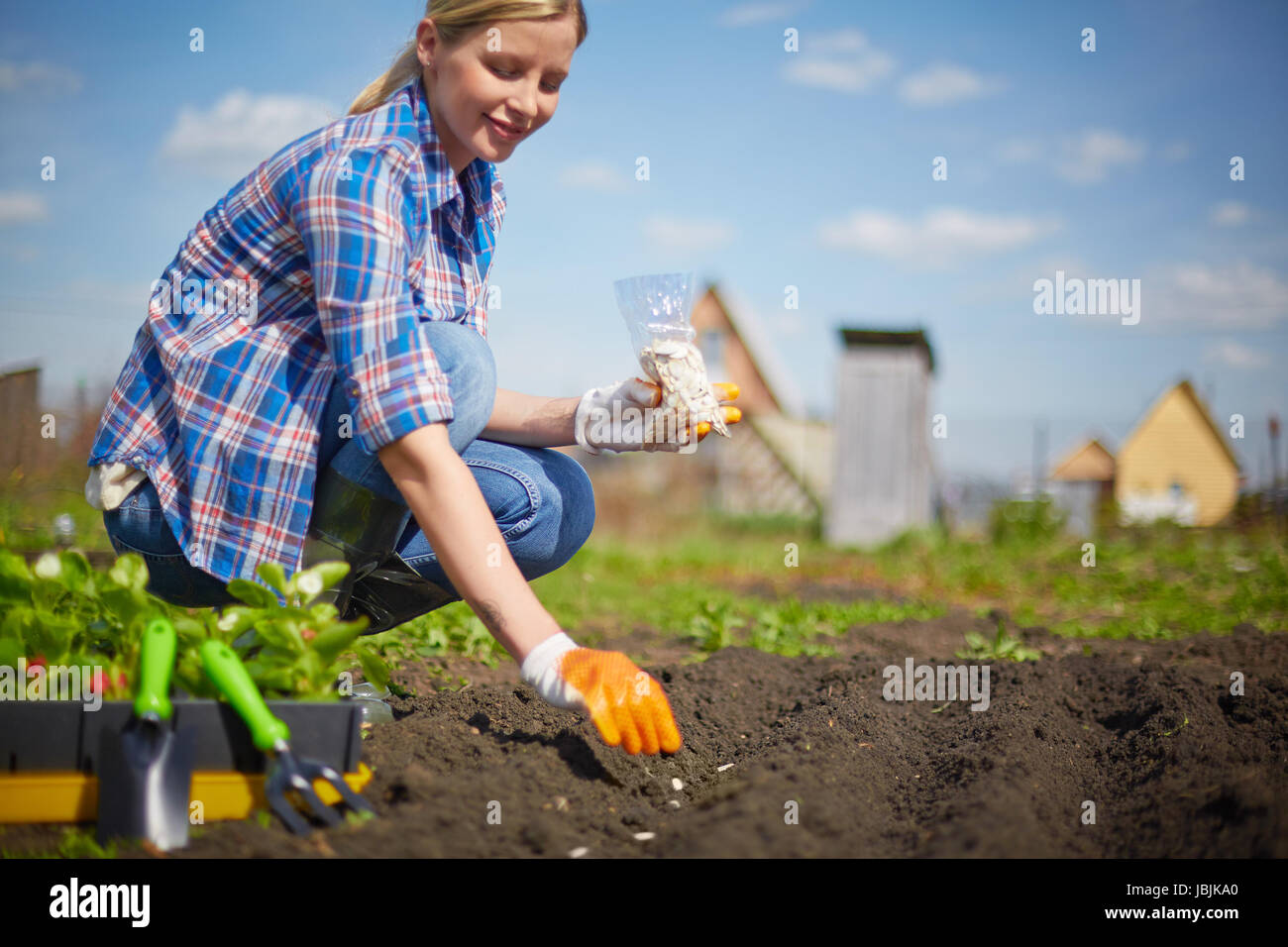 Image female farmer sowing seed hi-res stock photography and images - Alamy