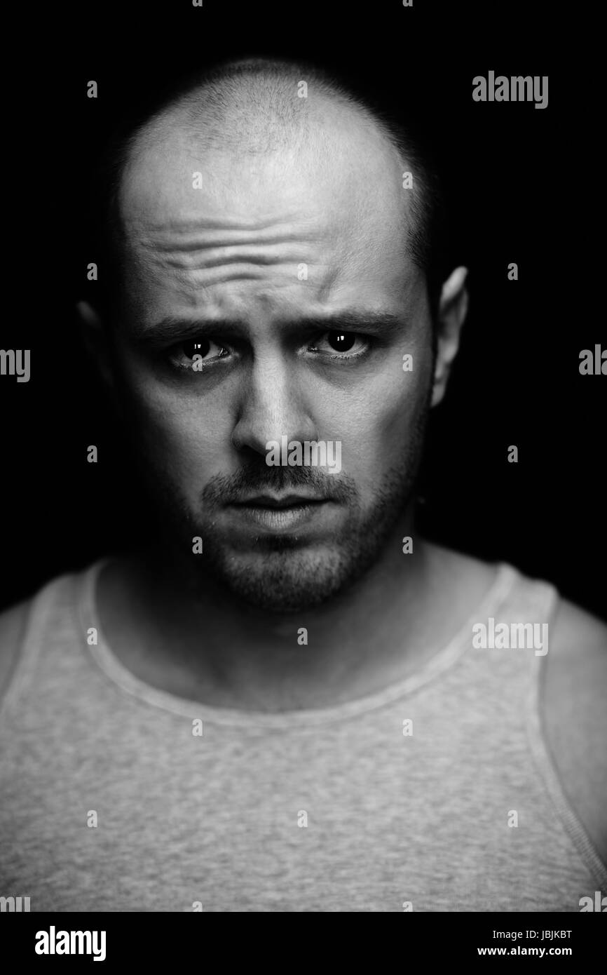 Vertical portrait of serious guy looking at camera Stock Photo - Alamy