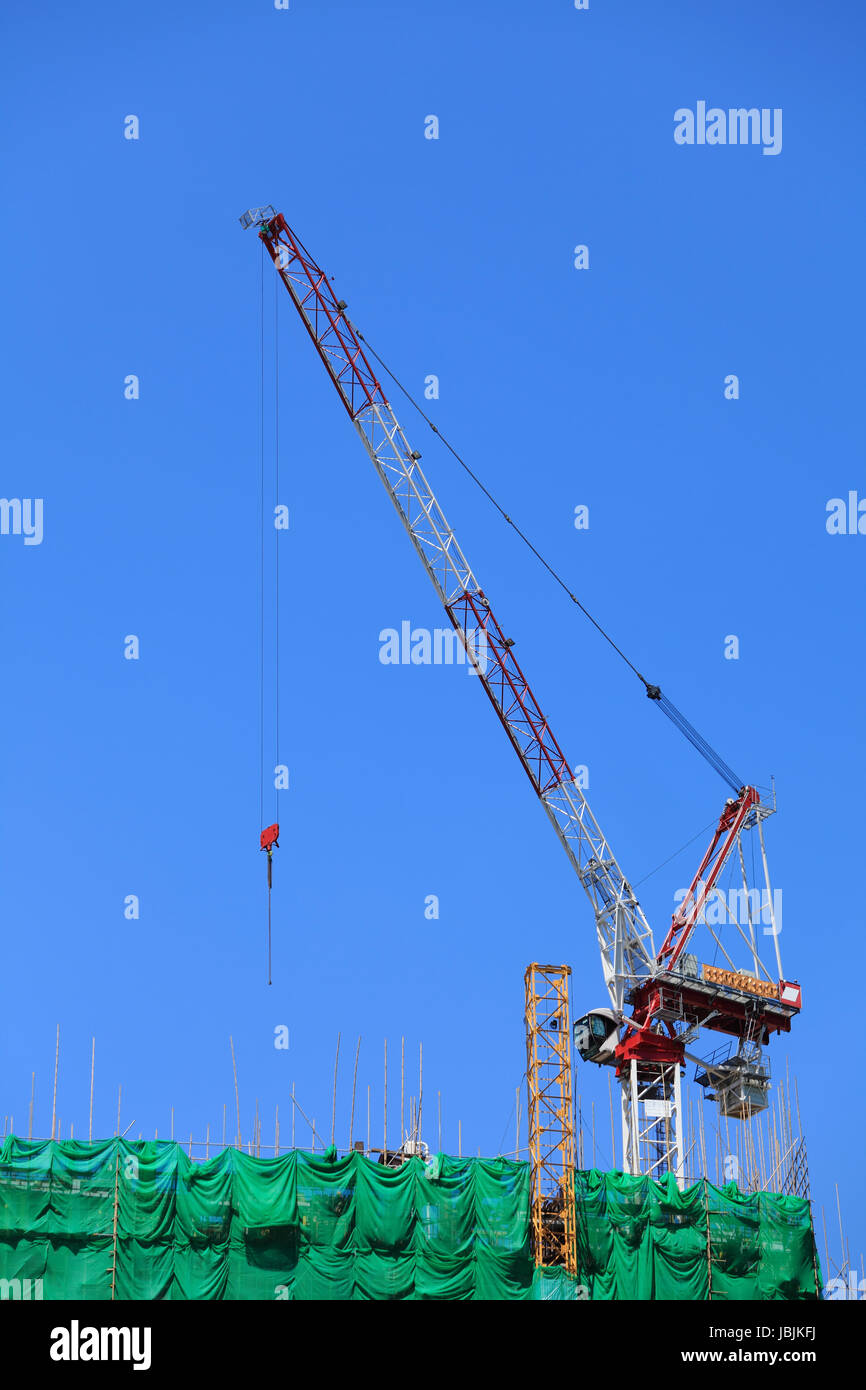 Construction crane on the roof top Stock Photo - Alamy