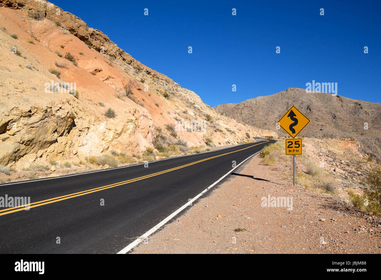 Highway and traffic sign in the yellow desert of Nevada Stock Photo - Alamy