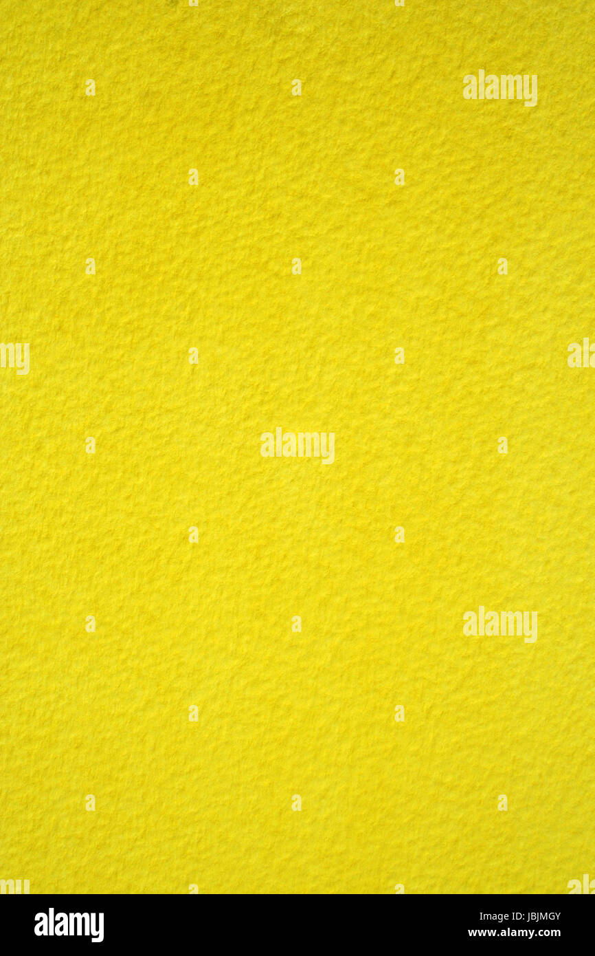 Yellow color painted background on paper Stock Photo - Alamy