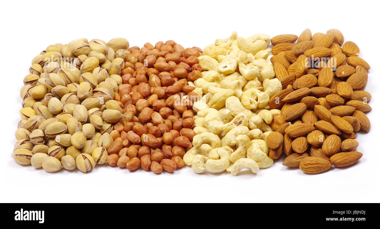 various nuts on a white background Stock Photo - Alamy