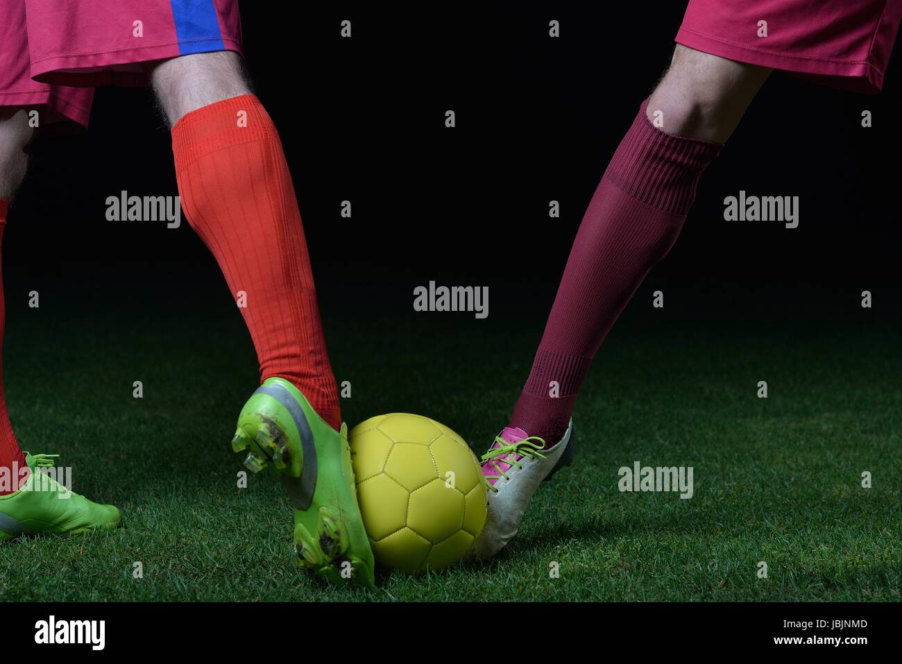 soccer player doing kick with ball on football stadium field isolated ...