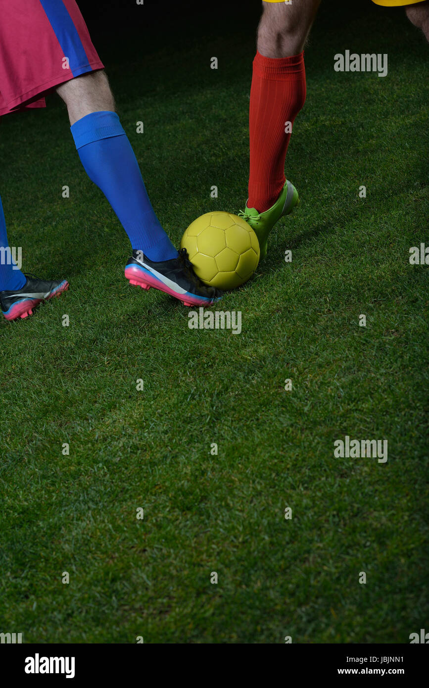 soccer player doing kick with ball on football stadium field isolated ...