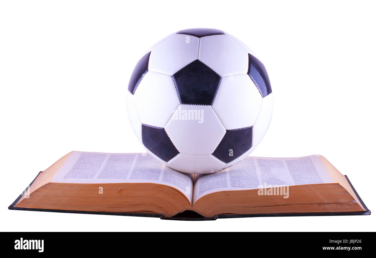 Soccer ball over book, isolated over white background Stock Photo - Alamy