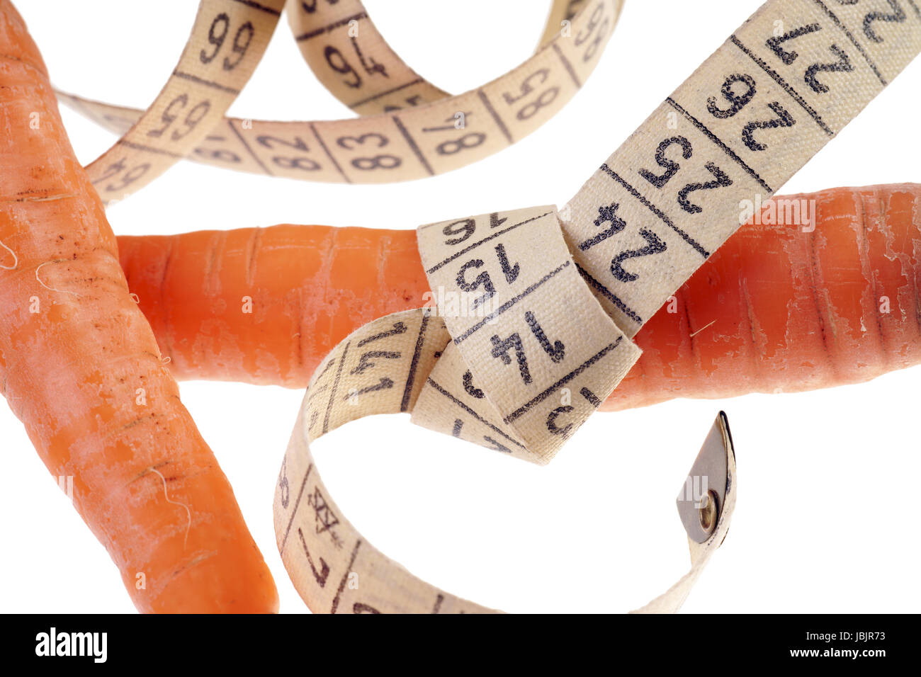 Carrots with measuring tape Stock Photo - Alamy