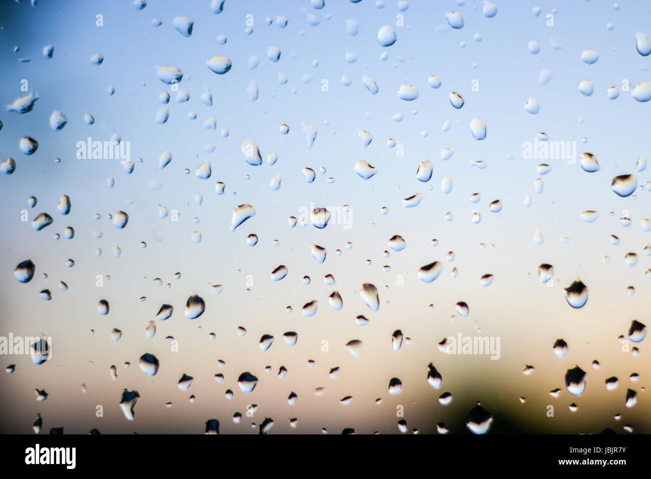 Many rain drops on window Stock Photo - Alamy