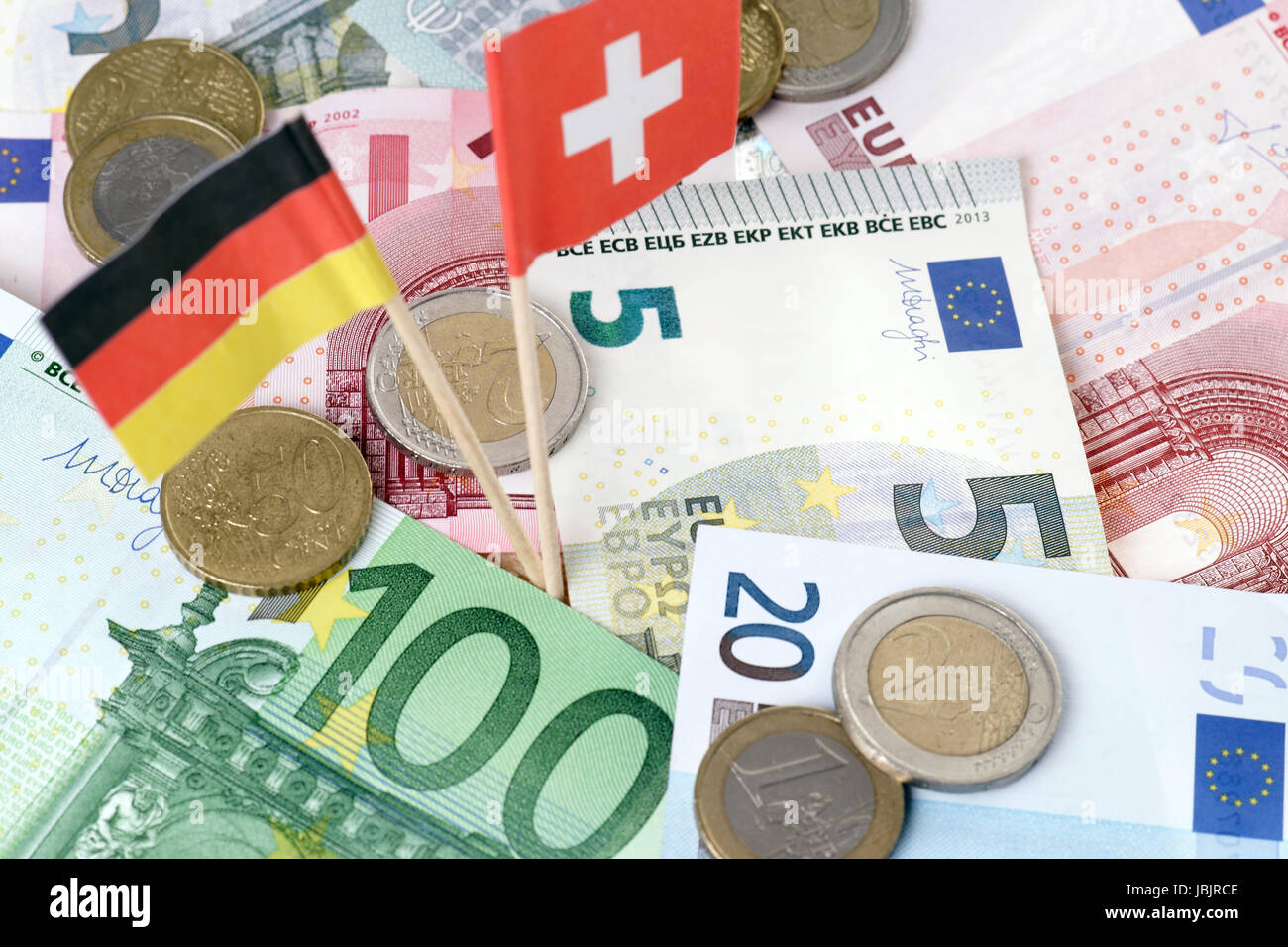 euro banknotes and swiss and germany flag Stock Photo - Alamy