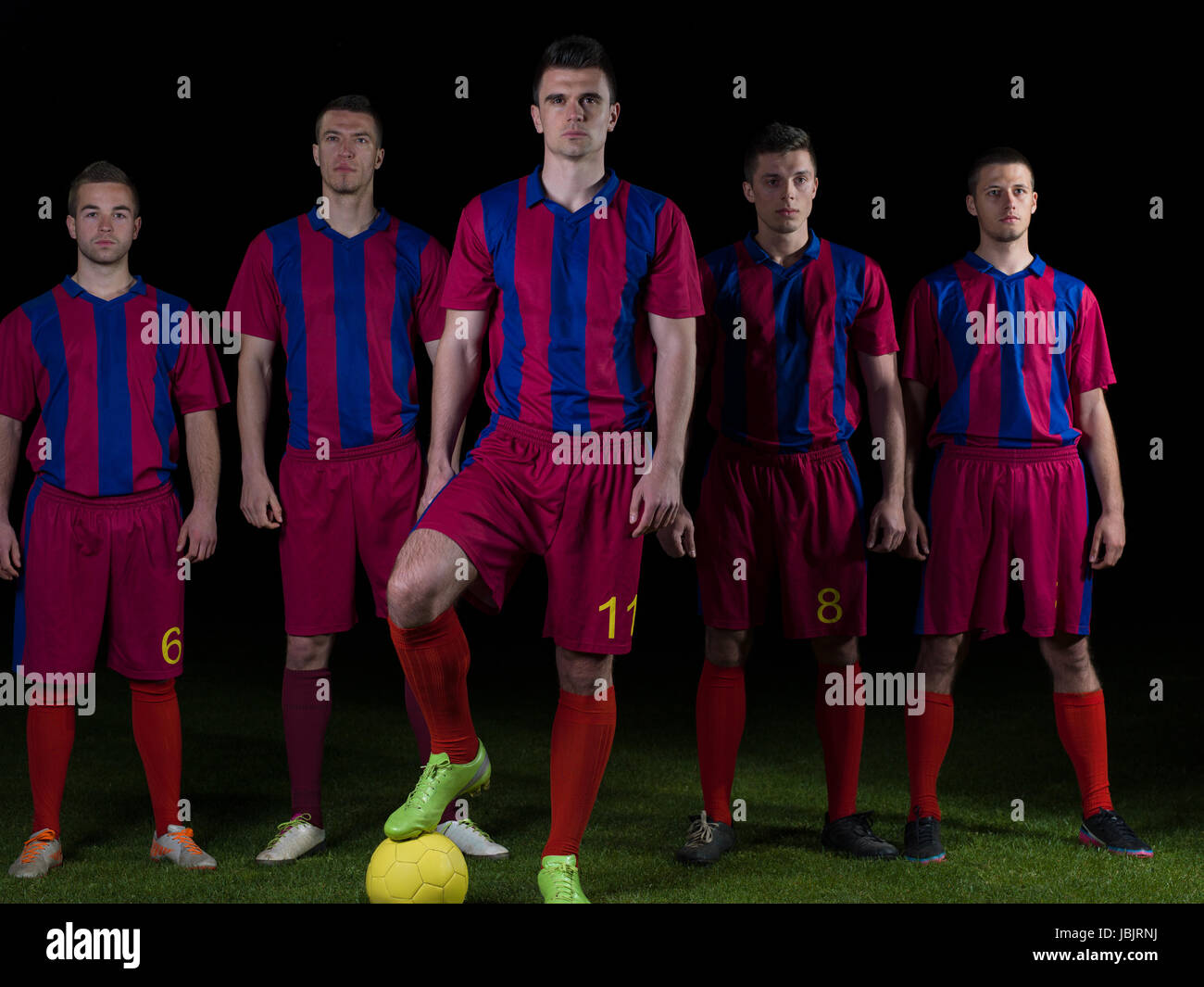 soccer players team group isolated on black background Stock Photo - Alamy