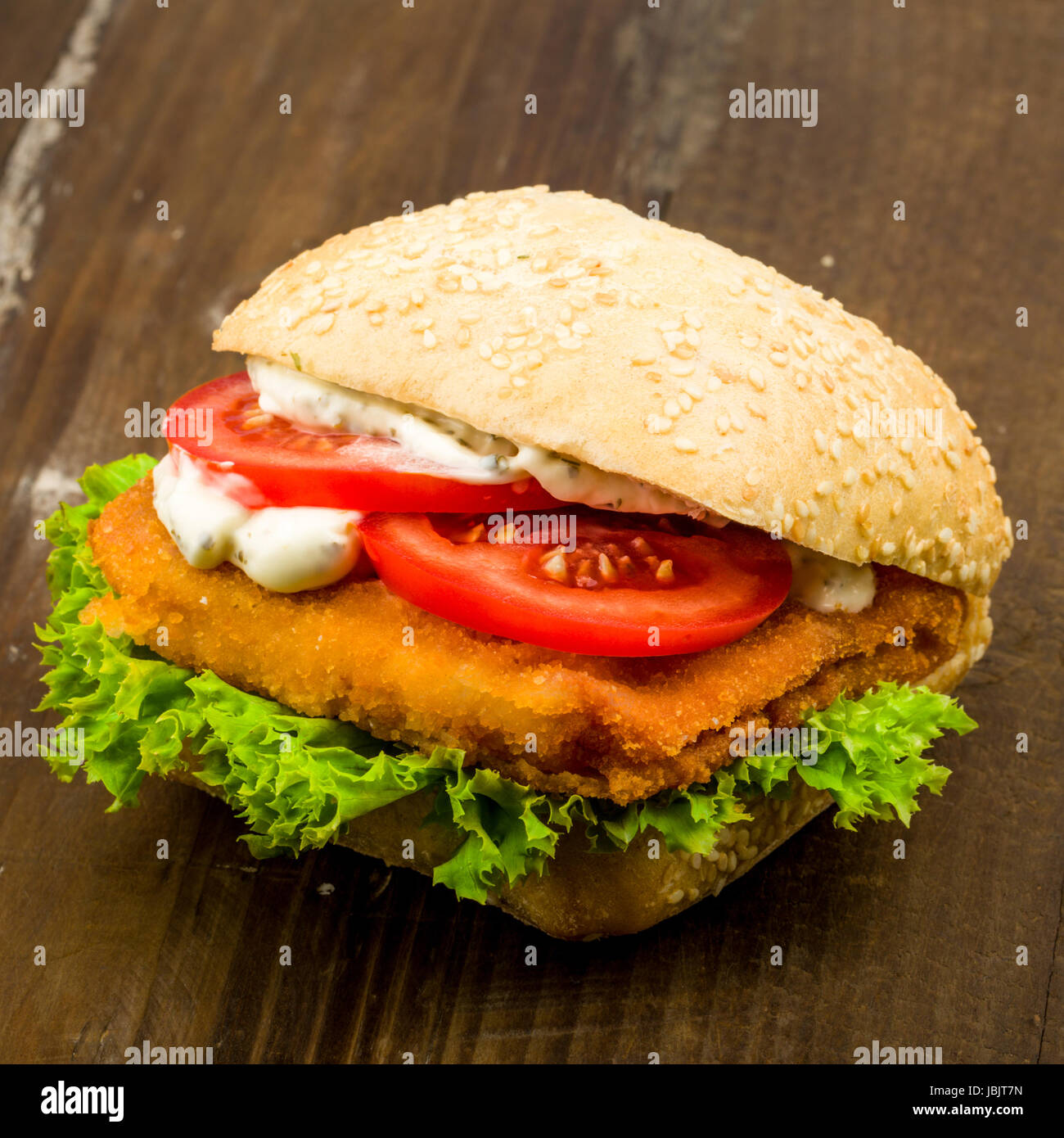 fish bun with tomato salad and remoulade Stock Photo - Alamy