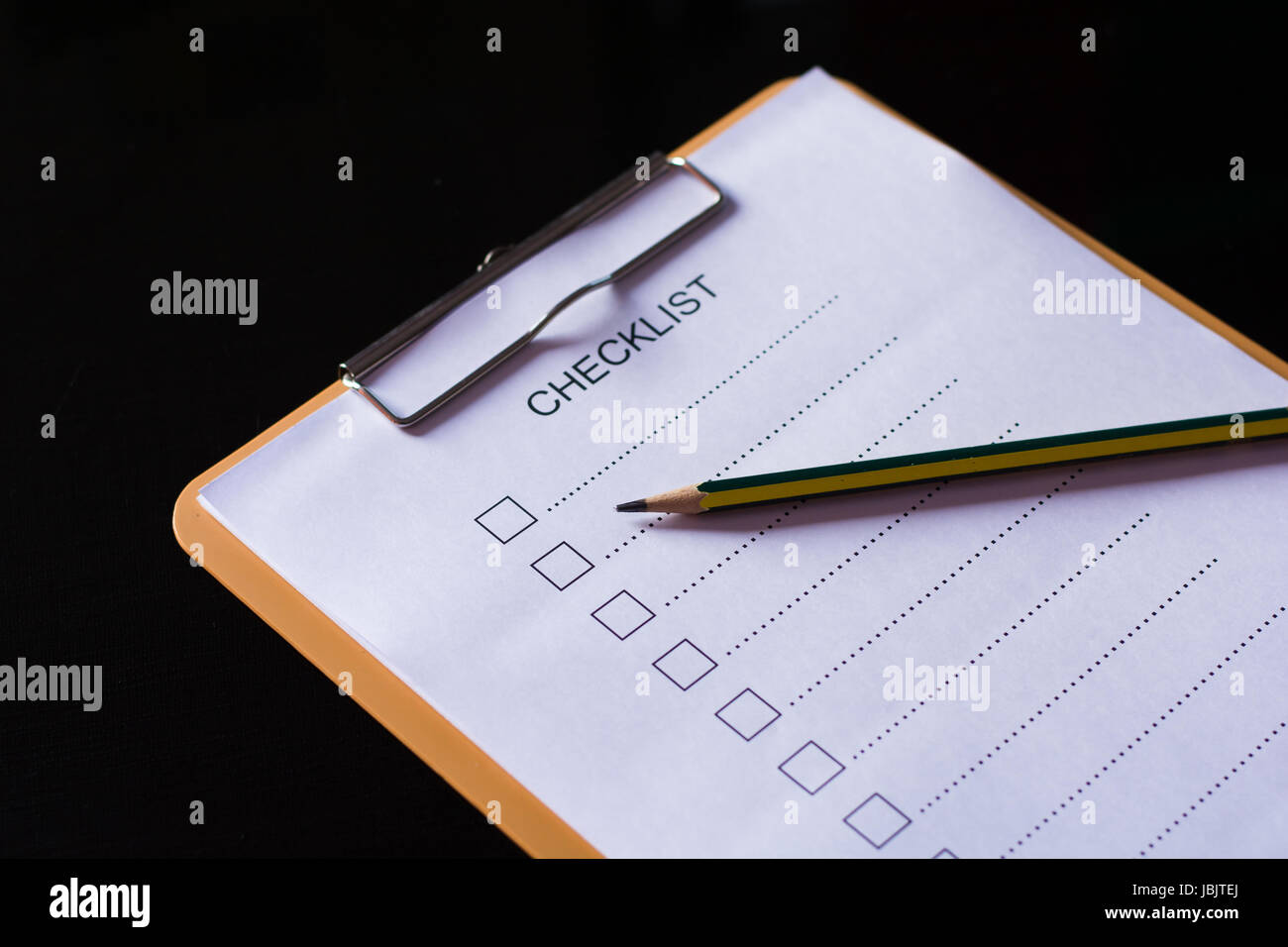 Checklist concept - checklist, paper and a pen with checklist word on ...