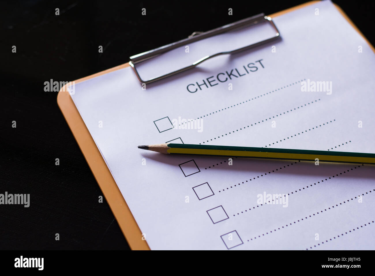 Checklist concept - checklist, paper and a pen with checklist word on ...
