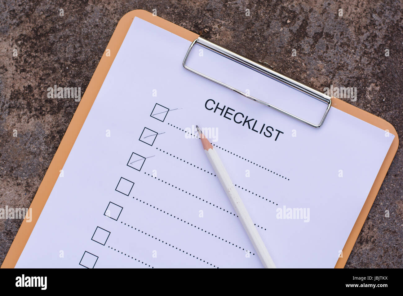 Checklist concept - checklist, paper and a pen with checklist word on ...