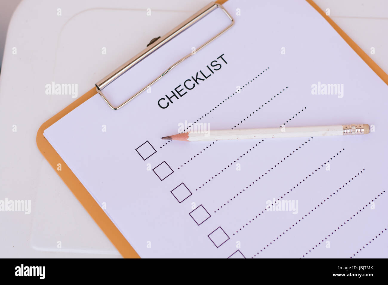 Checklist concept - checklist, paper and a pen with checklist word on ...