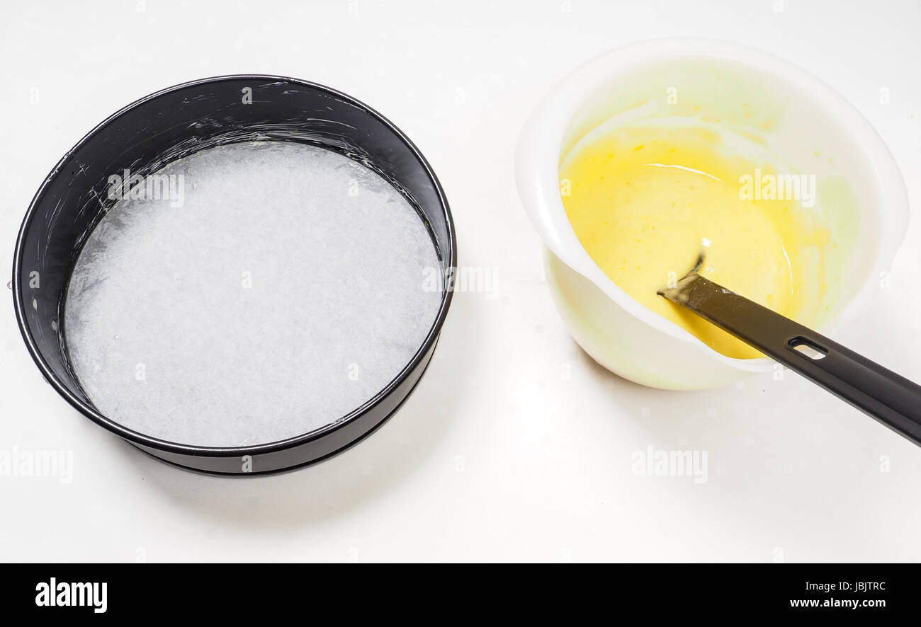 Yellow mixture is ready for the black ring cake shape with baking paper ...