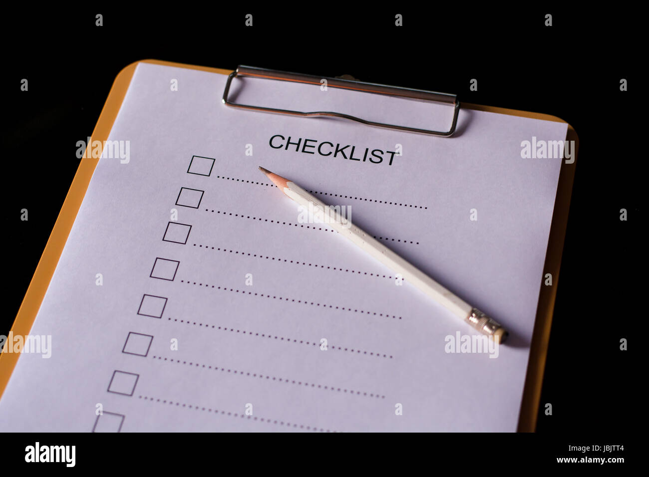Checklist concept - checklist, paper and a pen with checklist word on ...