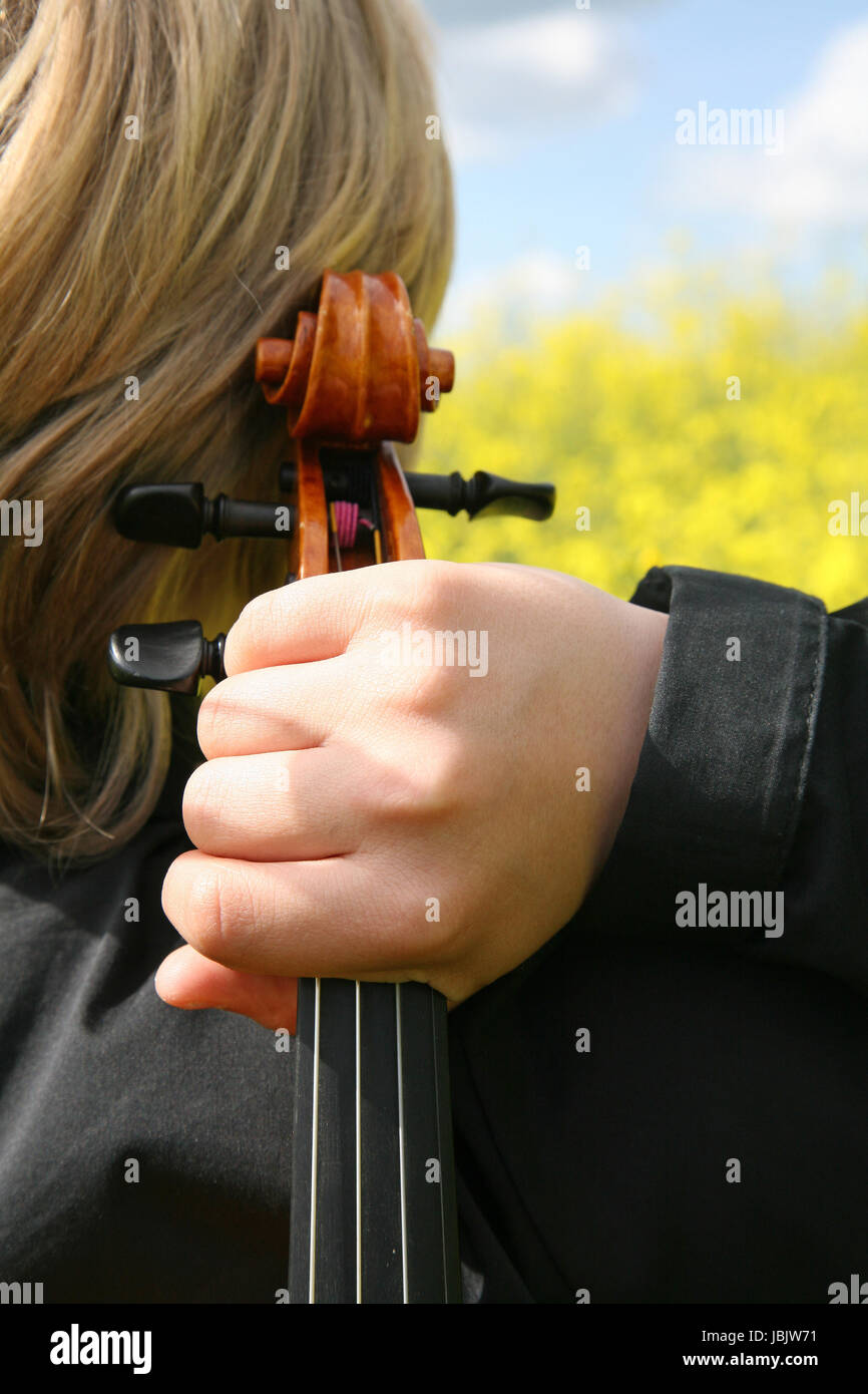 young from behind with violin Stock Photo - Alamy