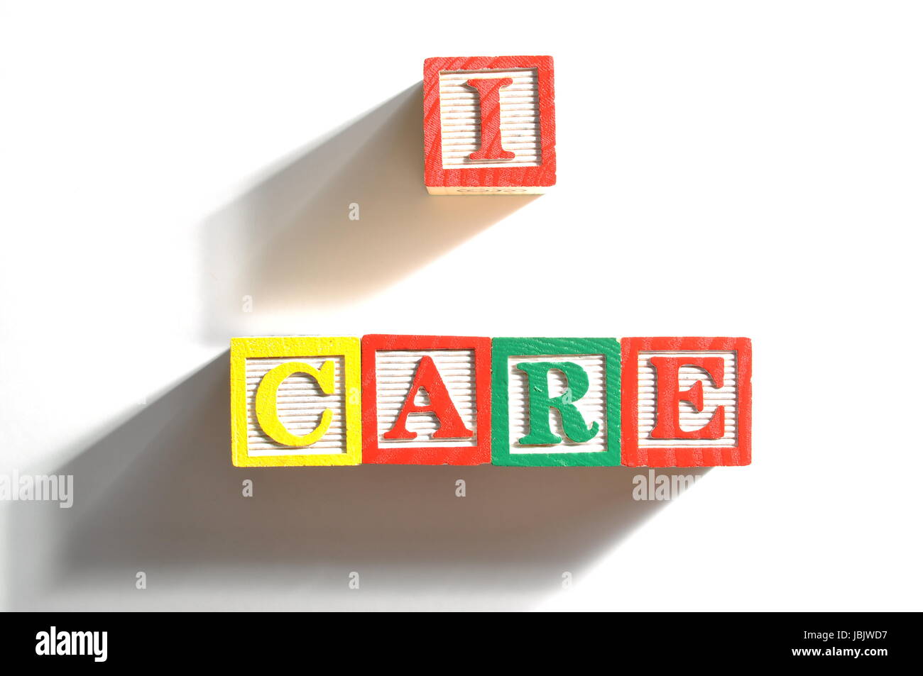 I care block on white background Stock Photo - Alamy