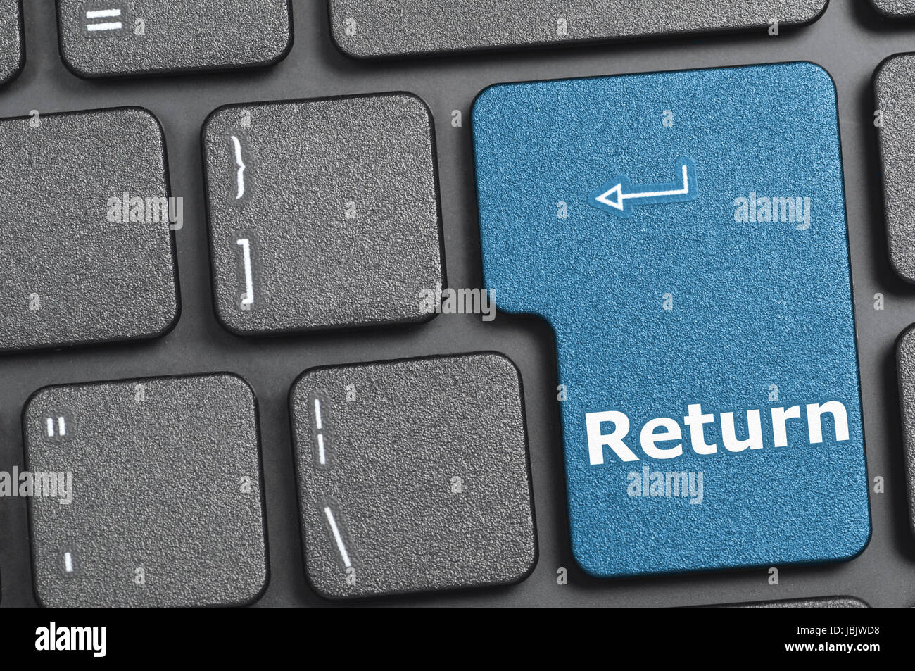 Blue return key on keyboard Stock Photo - Alamy