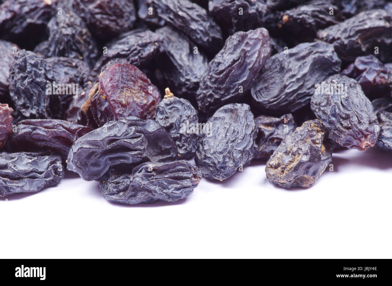 raisins isolated on a white background Stock Photo - Alamy