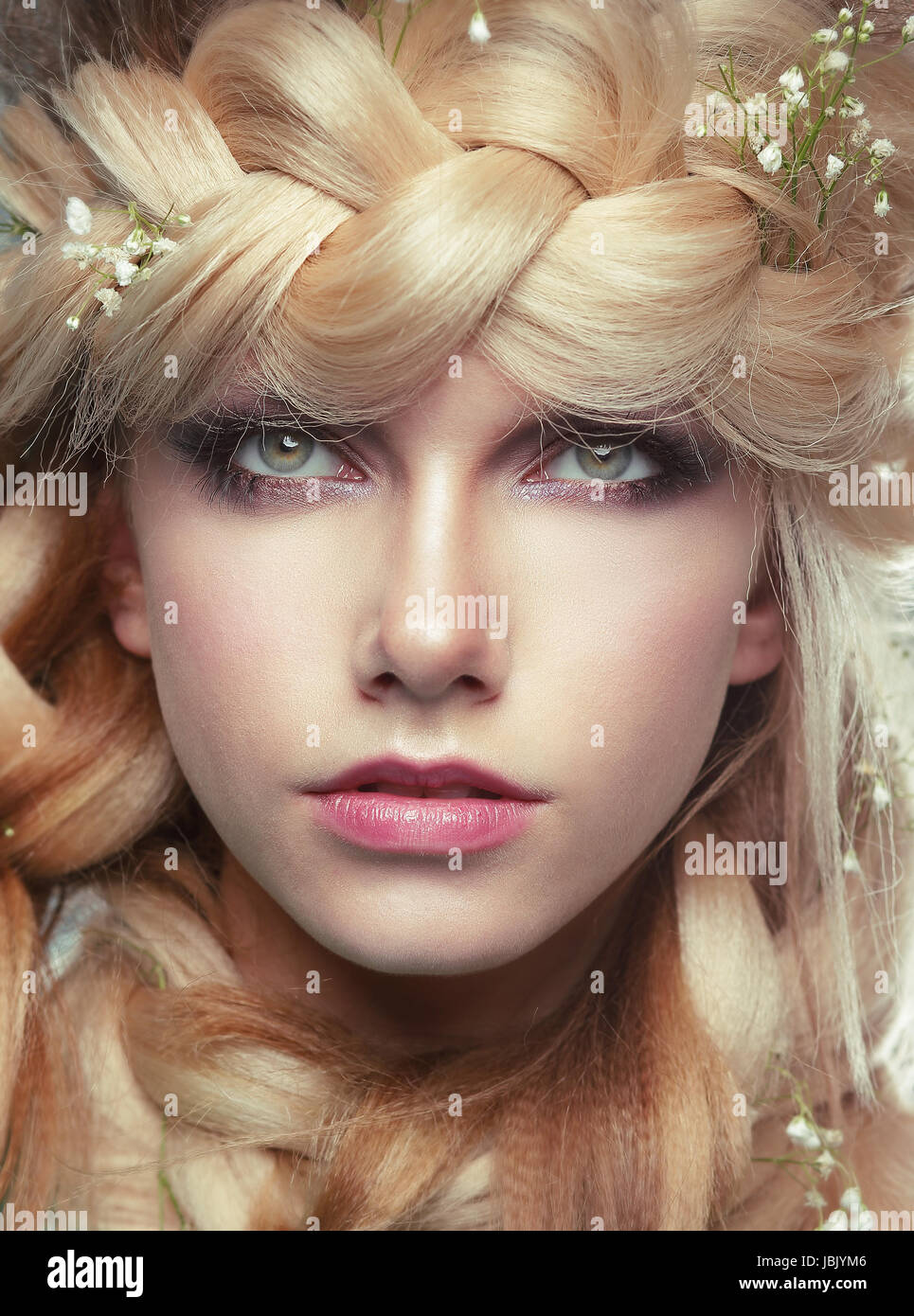 Closeup Portrait of Young Woman with Tress and Flowers Stock Photo - Alamy
