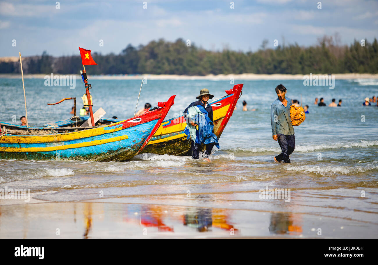 Fishing boat vs fisherman on the beach - Tan Hai Beach Ham Tan - Dinh ...