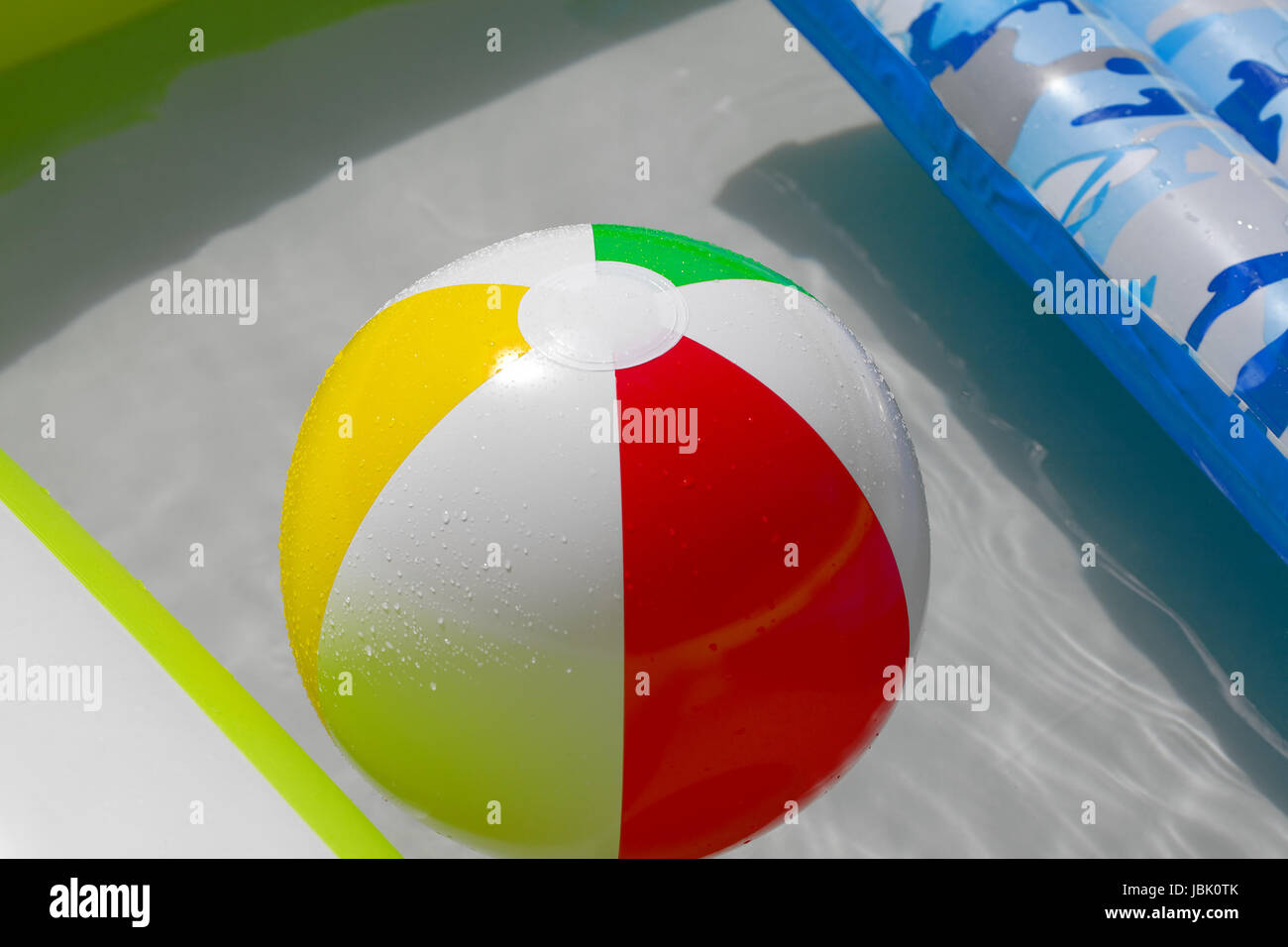 Rubber ball in a swimming pool Stock Photo - Alamy