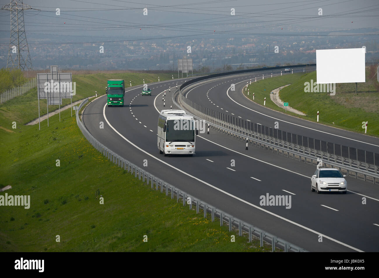 Highway with cars passing by Stock Photo - Alamy